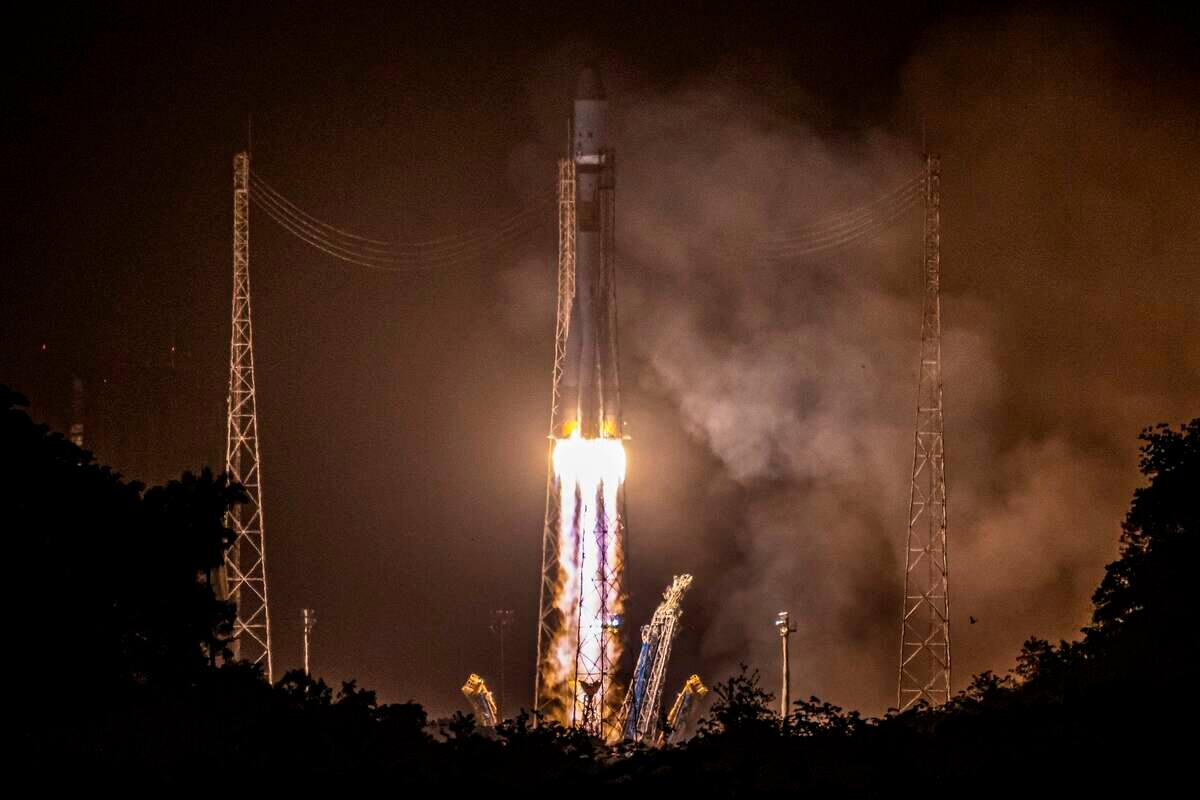 A Soyuz rocket with two Russians and an American on board arrives on ...