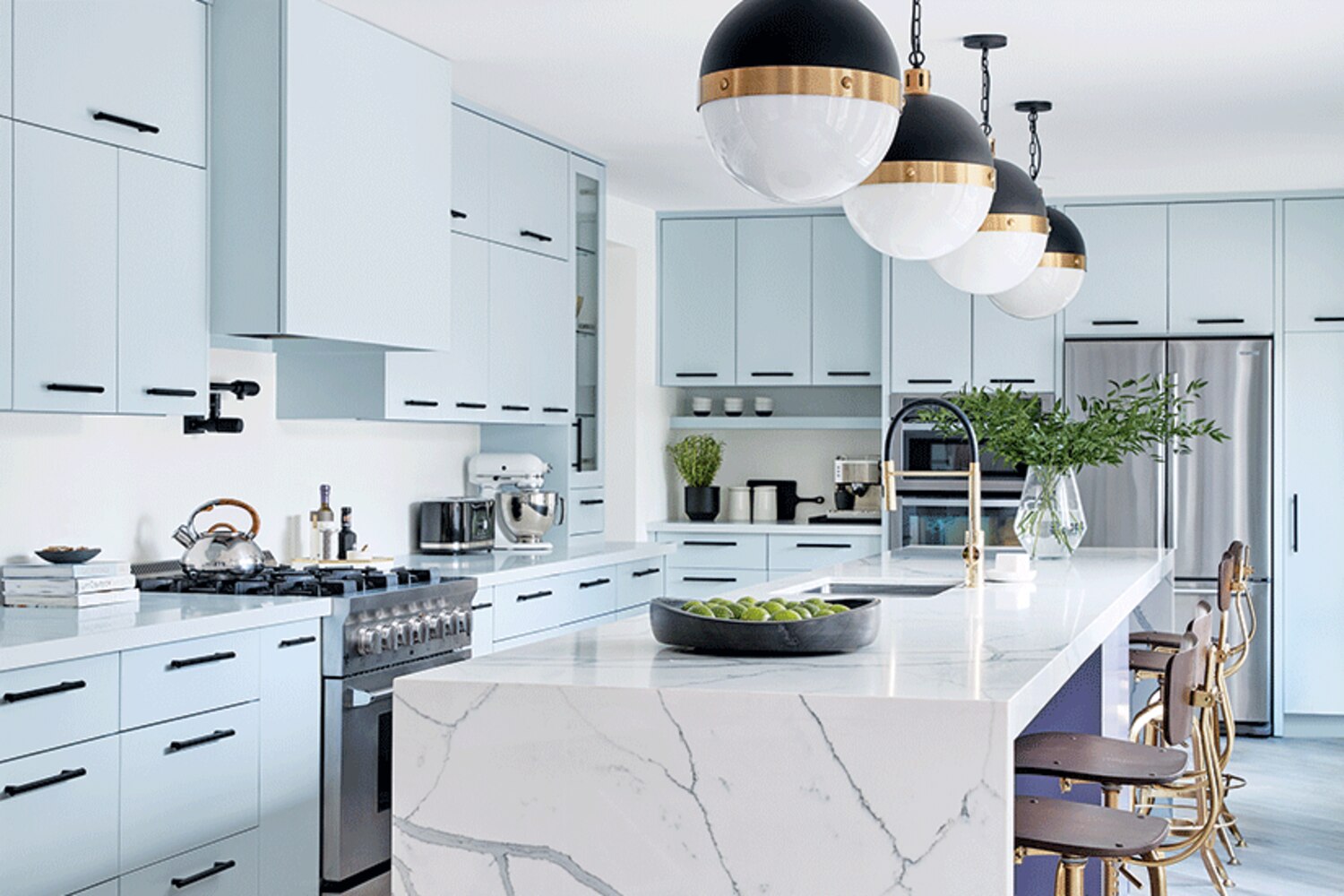 Icy blue cabinetry and a marble-look island give this kitchen a retro ...