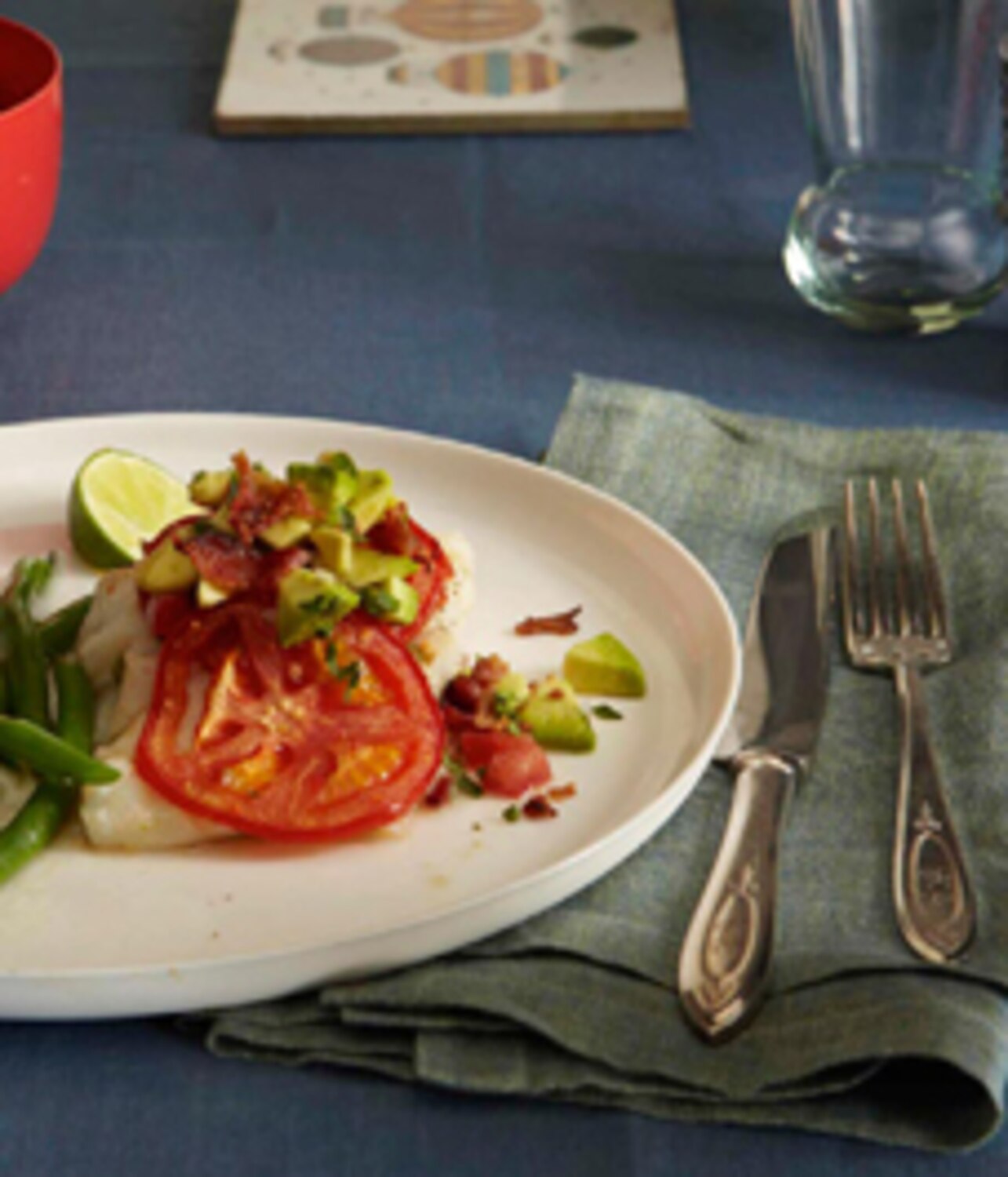 Recipe: Roasted cod with tomatoes and chunky guacamole salsa | Style at ...